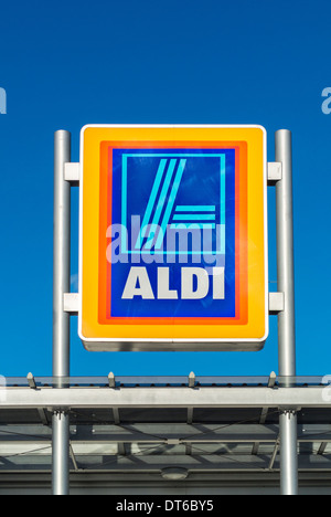ALDI supermarket sign seen against a blue sky Stock Photo - Alamy
