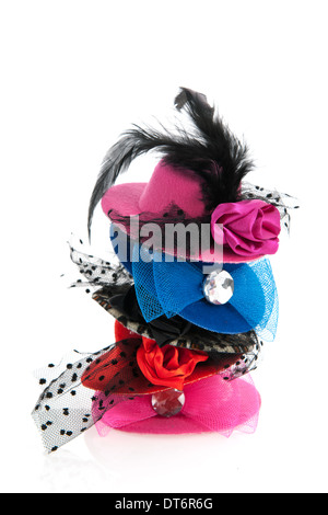Stacked female hats isolated over white background Stock Photo - Alamy