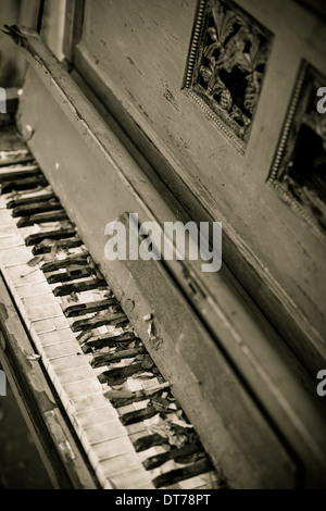 Old broken vintage piano. Black destroyed and forgotten piano in ...