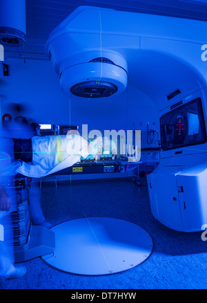 Male cancer under a linear accelerator or linac receiving radiation ...