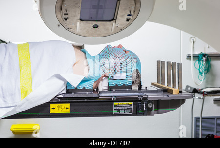 Male cancer under a linear accelerator or linac receiving radiation ...