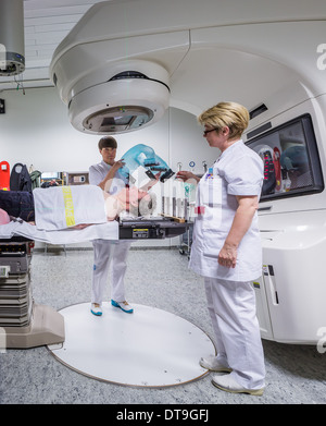 Male cancer under a linear accelerator or linac receiving radiation ...