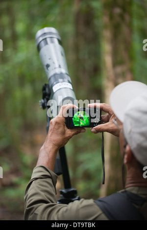 Local guide Digiscoping for birds. (Trogan sp. ). Using camera eyepiece ...