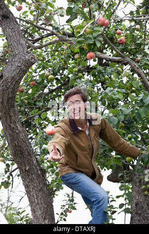 Man throwing apple Stock Photo - Alamy