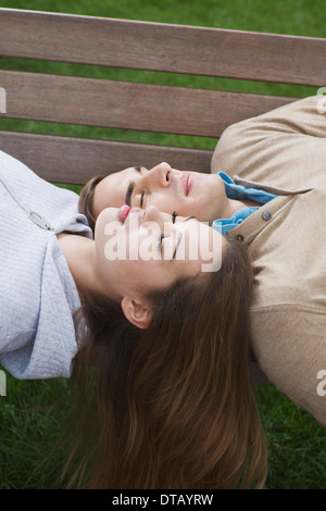 two men sleeping on bench Stock Photo - Alamy