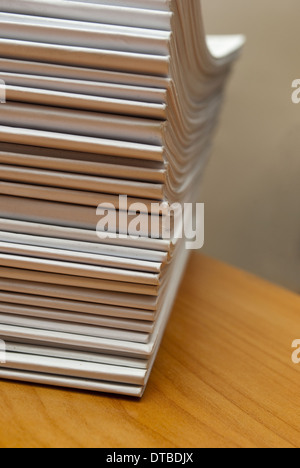 Stack of white journals in office desktop. Shallow deep of field Stock ...