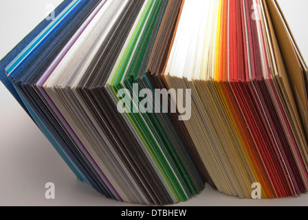 Colored paper stock stand on white background Stock Photo - Alamy