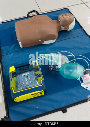 Emergency life saving equipment including a defibrillator mounted on ...