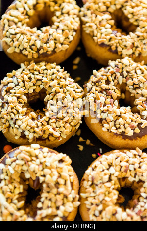 Fresh donuts with different toppings from the local bakery shop Stock ...