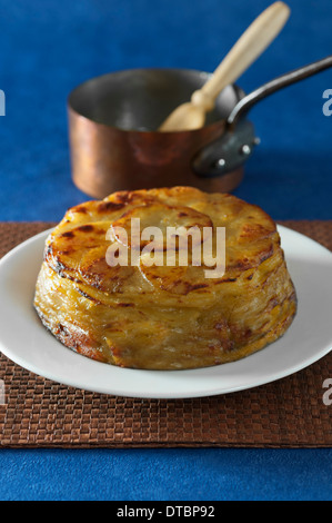 Pommes Anna classic French dish of sliced, layered potatoes cooked in a ...