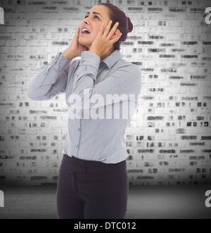 Composite image of desperate businesswoman Stock Photo - Alamy