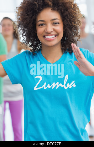 Cheerful female instructor doing pilates exercise Stock Photo - Alamy