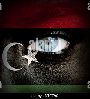 Human face painted with flag of Libya Stock Photo - Alamy