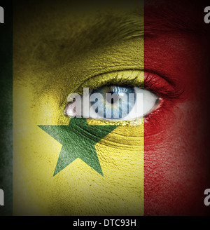 Human face painted with flag of Senegal Stock Photo - Alamy