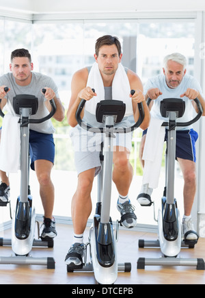 Men using exercise bikes Stock Photo - Alamy