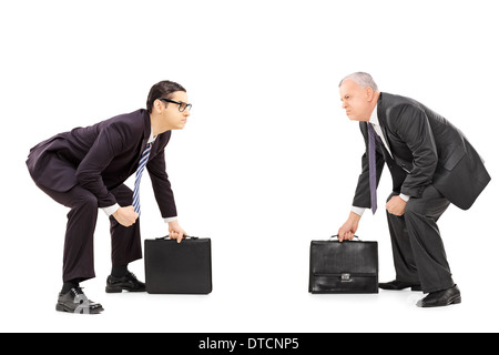 Two businessmen standing in sumo wrestling stance Stock Photo - Alamy