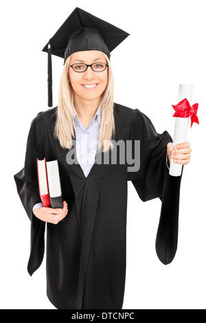 A girl holding books and graduation cap Stock Photo - Alamy