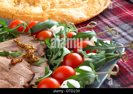 Italian appetizer snacks on checkered tablecloth close up Stock Photo ...