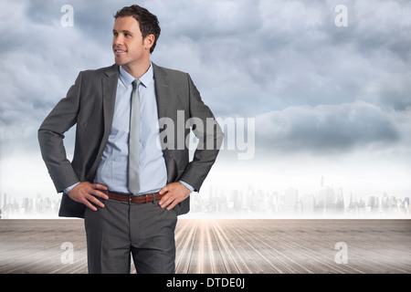 Businessman with hands on hips smiling isolated on white Stock Photo ...