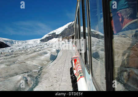 Snow Coach tour bus at the Athabasca Glacier. The Athabasca is the most ...