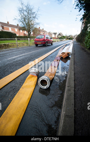 Hoses lie in the gutter in Chalgrove after the fire service spent the ...