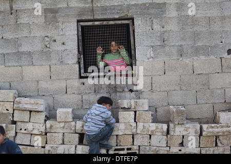 Palestinian children play next their house in a poor neighborhood of ...