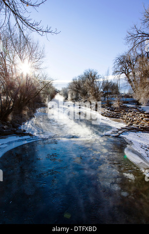Steam rises on a sub-zero morning from the snow and ice choked Arkansas ...