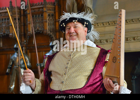 Musician in period costume performing on a medieval fiddle, Edinburgh ...