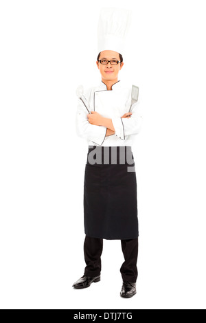 Attractive friendly chef or cook in uniform preparing spaghetti pasta ...