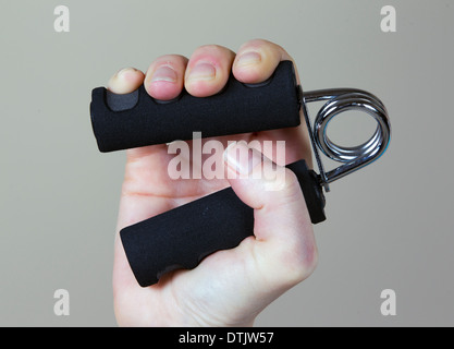 Closeup of female squeezing hand springs Stock Photo - Alamy