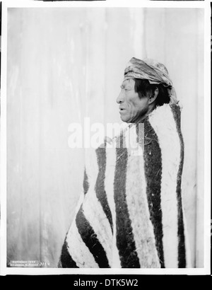 A portrait of Captain Big Water, a Walapai Indian, wrapped in a blanket ...