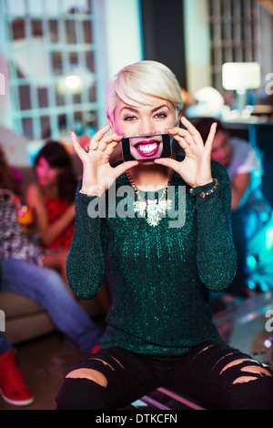 The young lady playing mobile phone games at home Stock Photo - Alamy