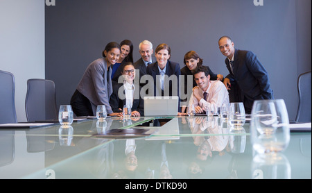 Group of people in front of a laptop, security concept Stock Photo - Alamy