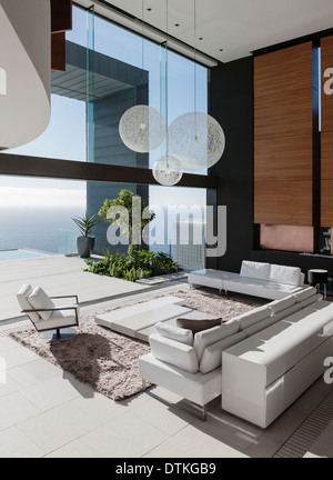 Window of room overlooking blue sky with white clouds. Opened window ...