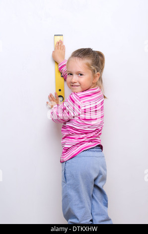 Little girl with measuring level Stock Photo - Alamy
