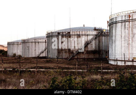Huge old rusty fuel tanks Stock Photo - Alamy