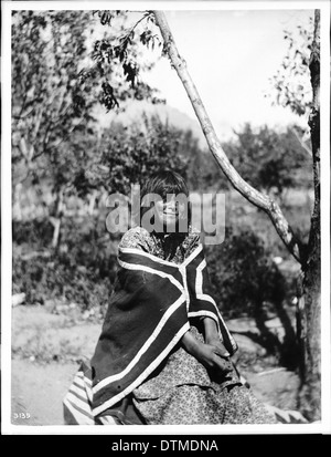 A photograph of a young Walapai Indian mother sitting with a child on ...