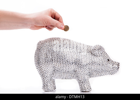 Piggy bank inlaid with gems isolated over white Stock Photo - Alamy