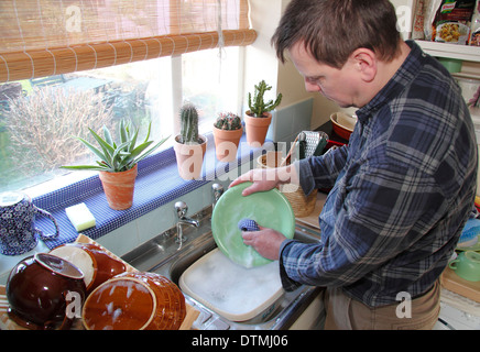 A man washing up Stock Photo - Alamy