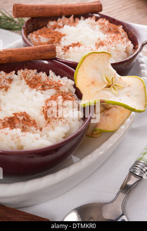 milk rice with cinnamon and applesauce Stock Photo - Alamy