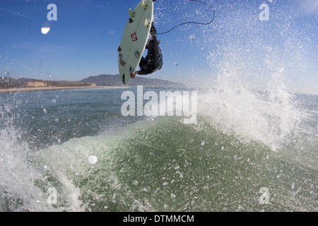 surfer catches some air in the ocean water sea Stock Photo - Alamy