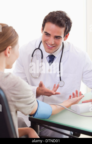 Doctor settle's down his patient Stock Photo - Alamy