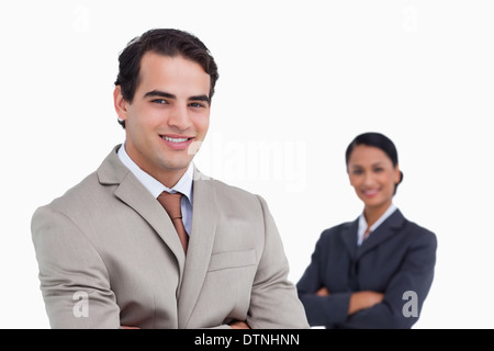 Smiling salesman with co-worker behind him Stock Photo - Alamy