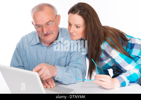 Helping with new computer Stock Photo - Alamy
