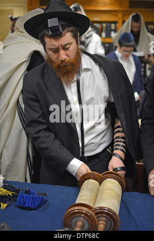 A blessing before Torah reading during weekday morning prayers at a ...