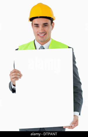 Expressive men holding a white sign for message Stock Photo - Alamy