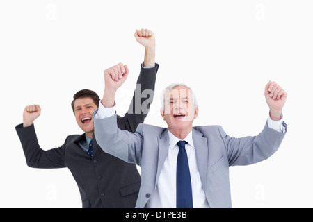 Close up of cheering businessmen Stock Photo - Alamy