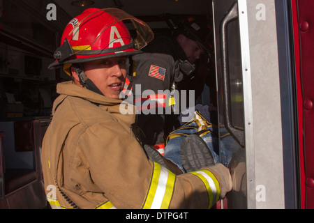 An EMT loading a patient into the back of an Ambulance Stock Photo - Alamy