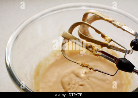 Hand mixer beaters mixing a smooth cookie dough batter - monochrome ...