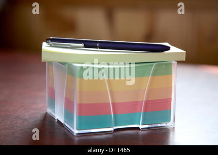 Pile of sticky note and pen Stock Photo - Alamy